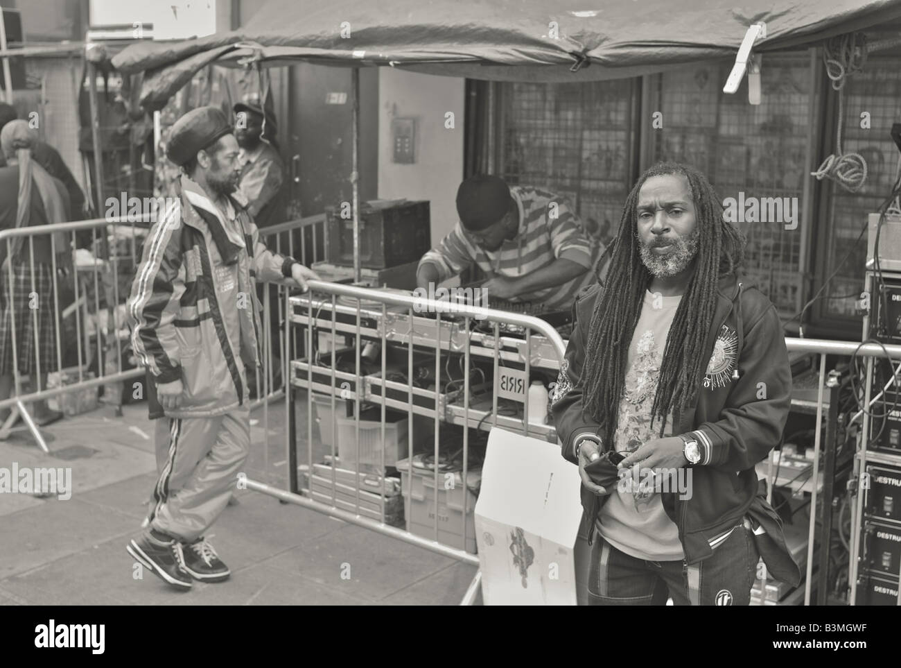 Musician in the street setting a sound system Stock Photo - Alamy