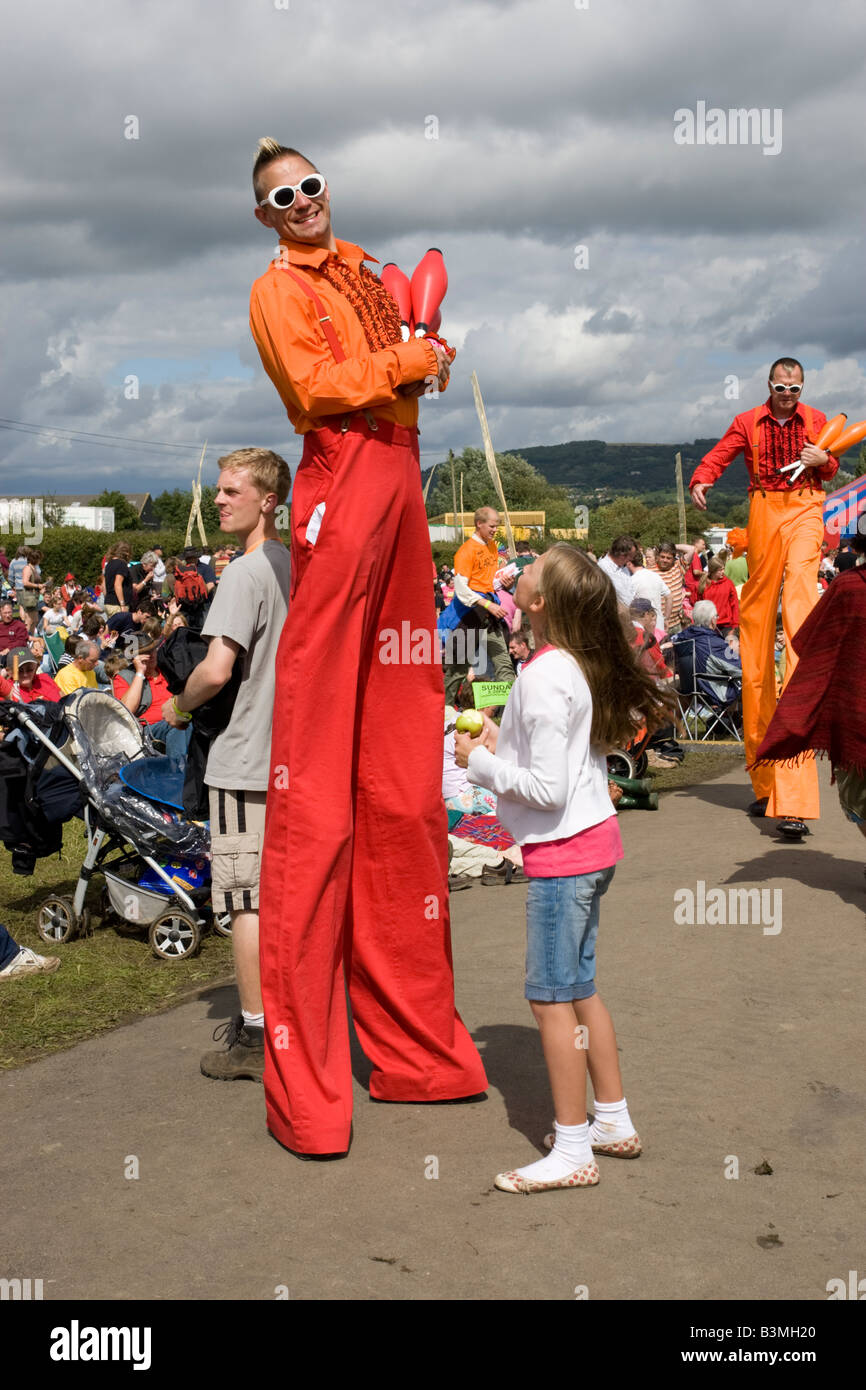 Two men jugglers on stilts with young admirer Greenbelt 2008 Cheltenham ...