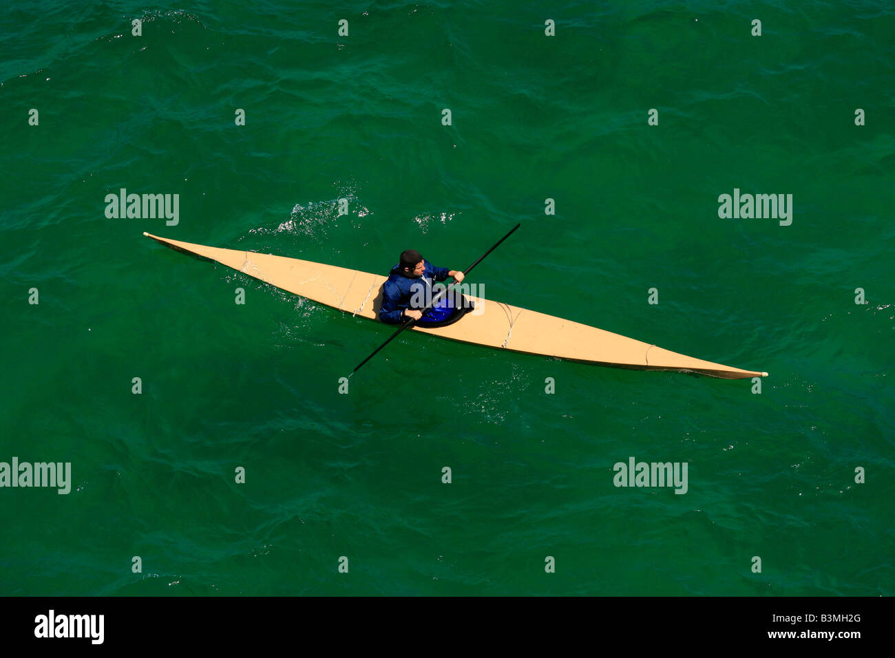 Lake Superior Michigan in USA US American a man in a kayak paddling ...