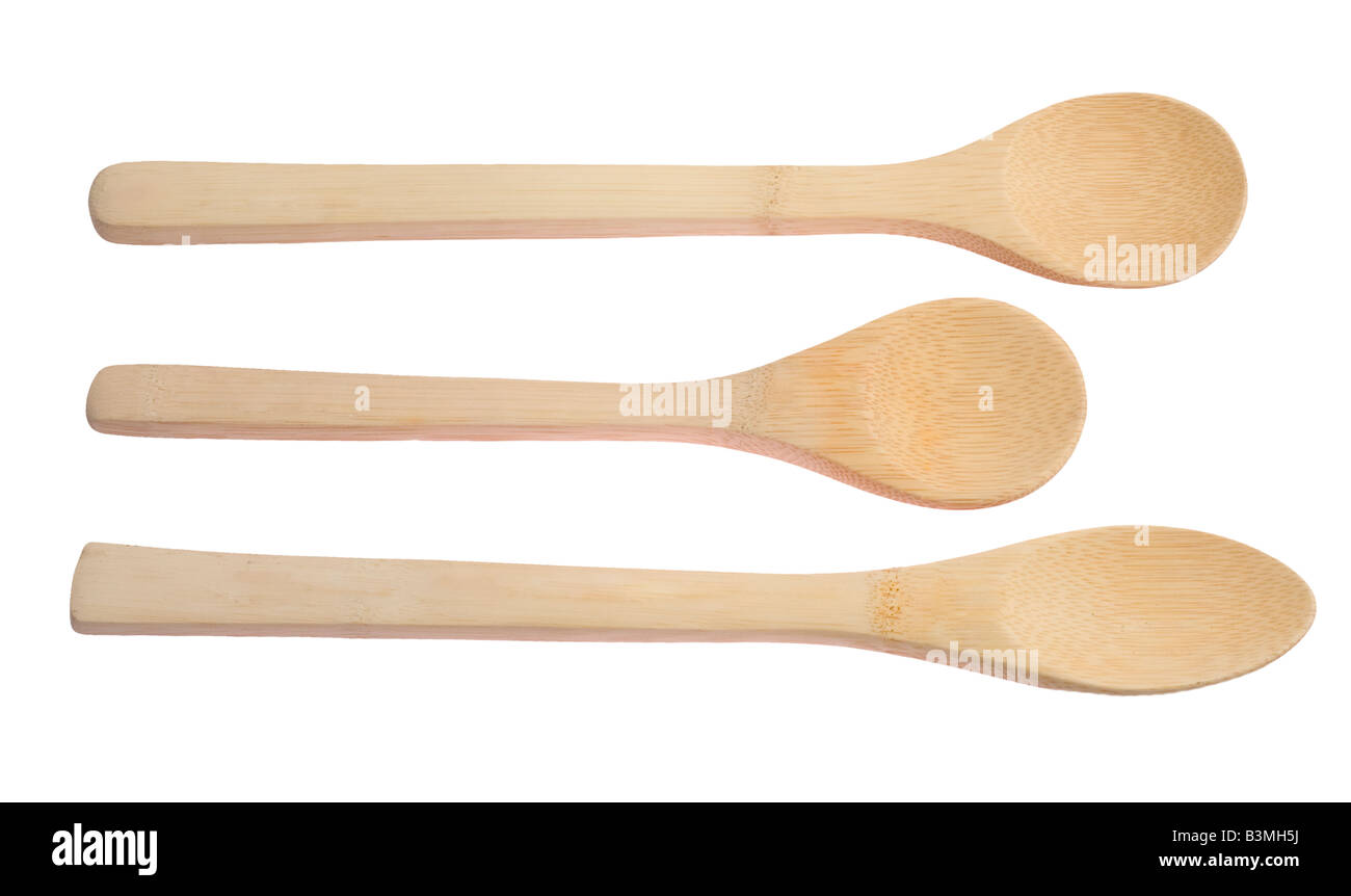 three wooden spoons isolated on white background Stock Photo - Alamy