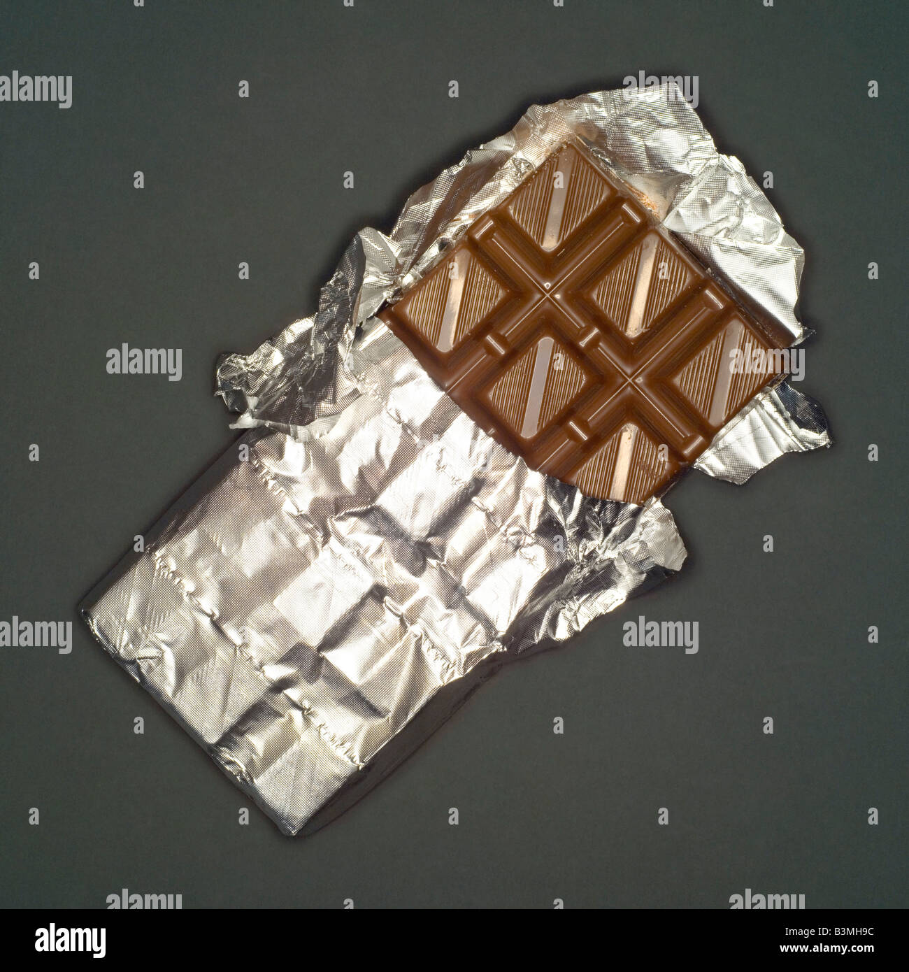 Unwrapped chocolate bar, elevated view Stock Photo - Alamy