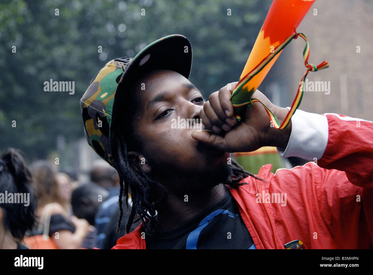 Man blowing into horn hi-res stock photography and images - Alamy