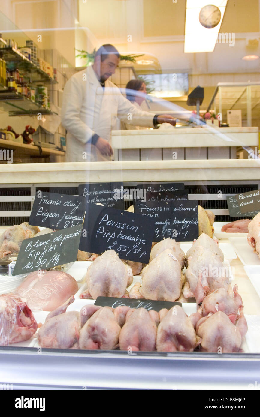 Window display of butchers showing local fresh game and fowl produce ...
