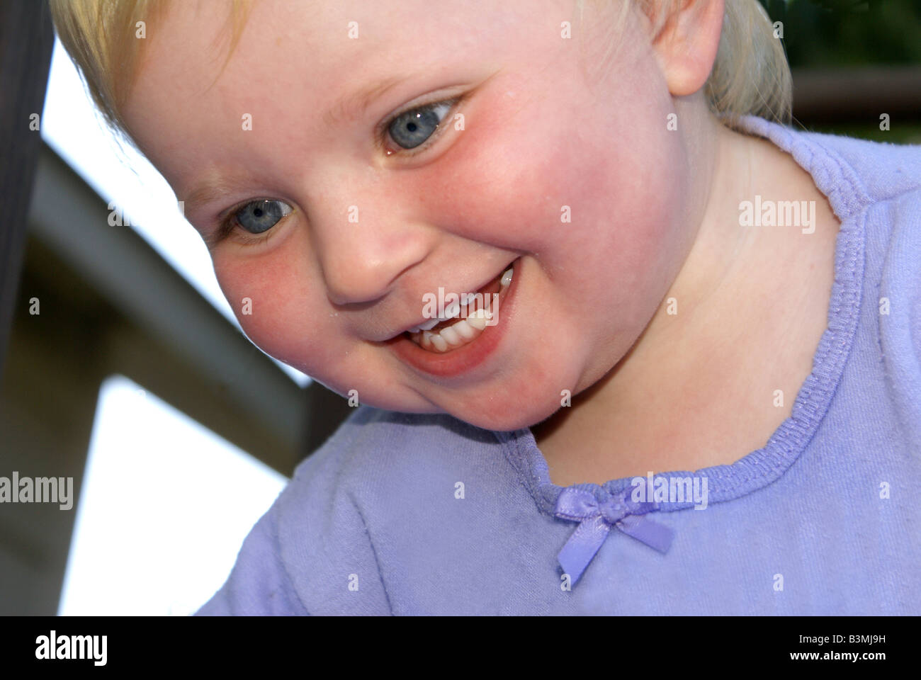 Close up laughing child anticipation hi-res stock photography and ...