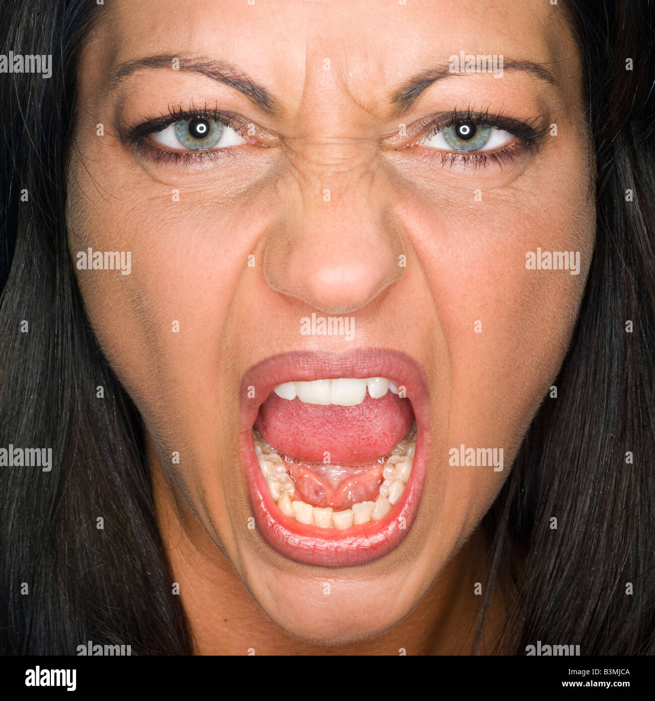 Young woman screaming, portrait, close-up Stock Photo - Alamy