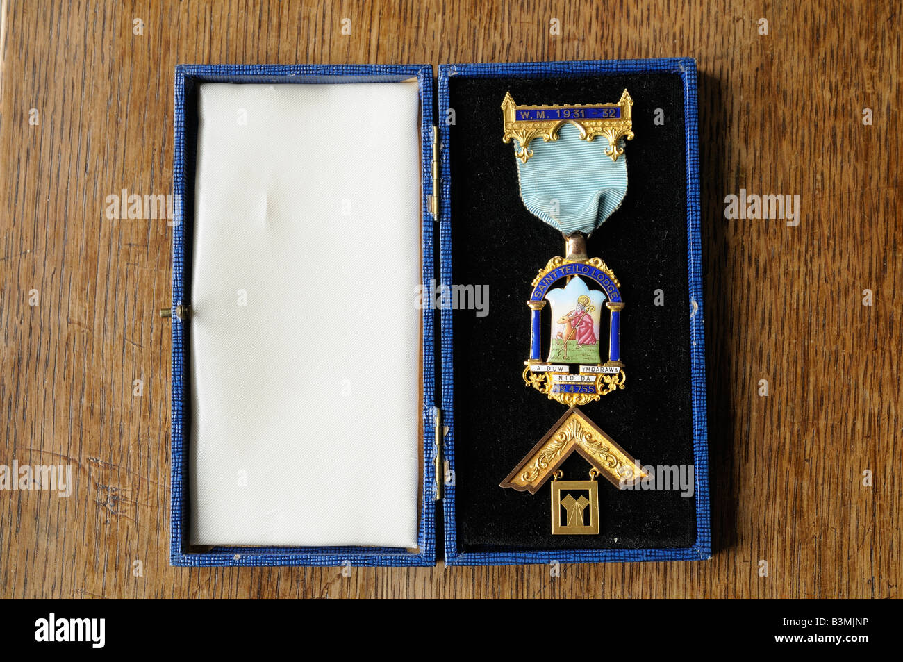 An old, gold, masonic medal dating from the 1930s with ribbon in ...