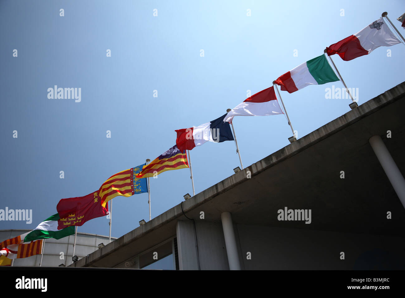 Line of Spanish regional flags against a blue sky Stock Photo - Alamy