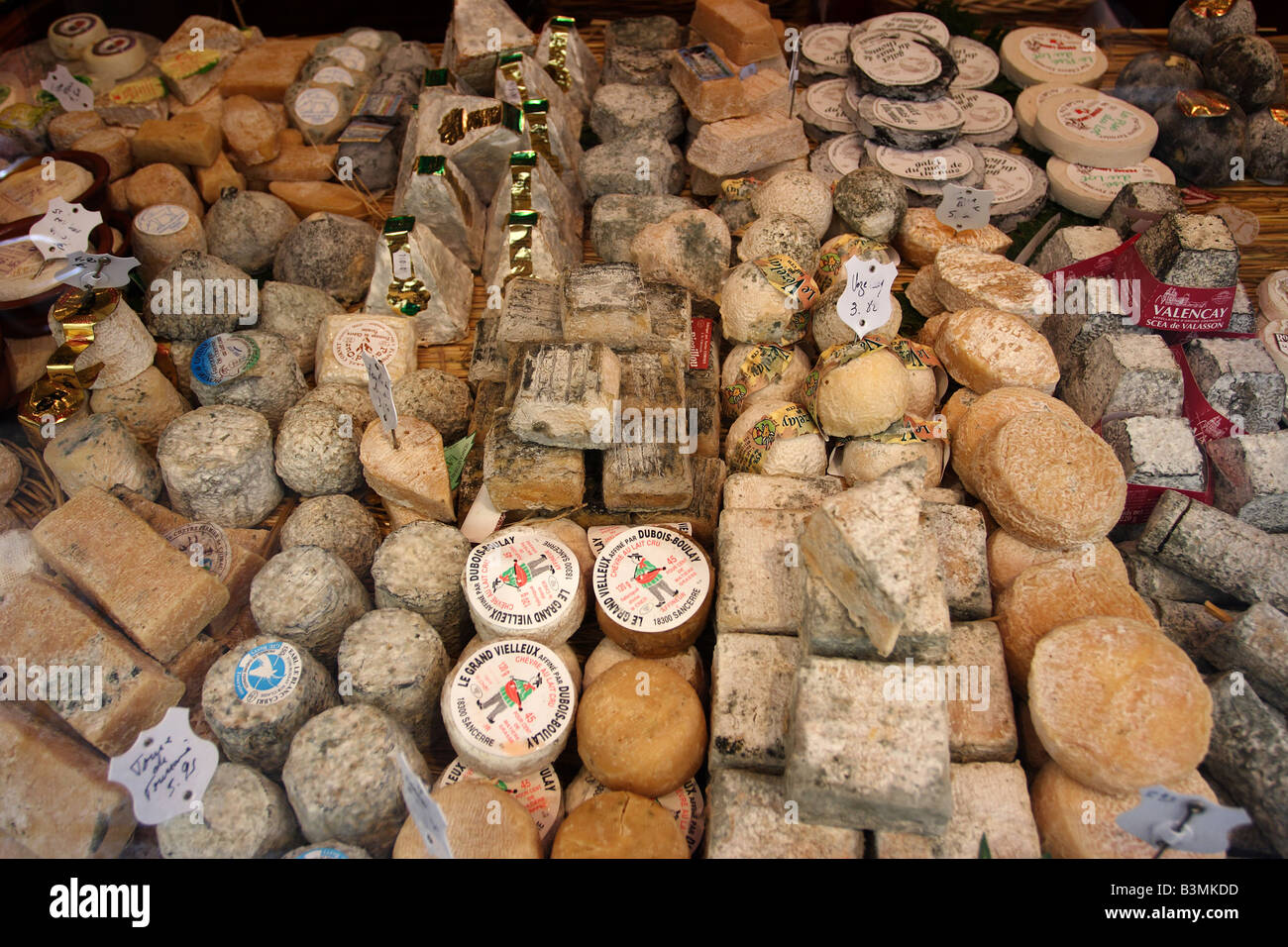 France Paris A variety of cheeses displayed in a shop window in Paris ...