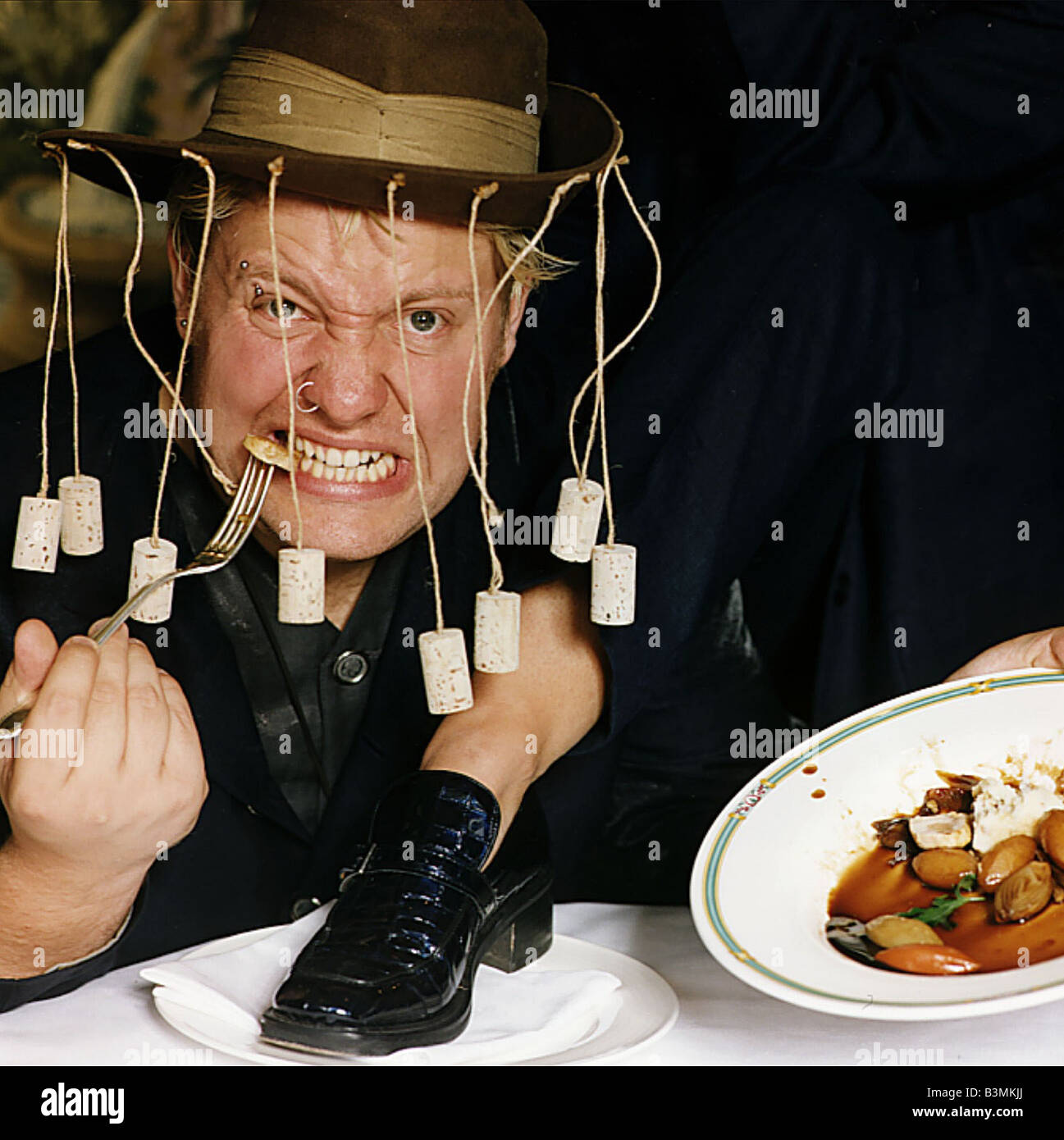 Ewan MacLeod TV presenter reporter eating crocodile burger crocodile ...
