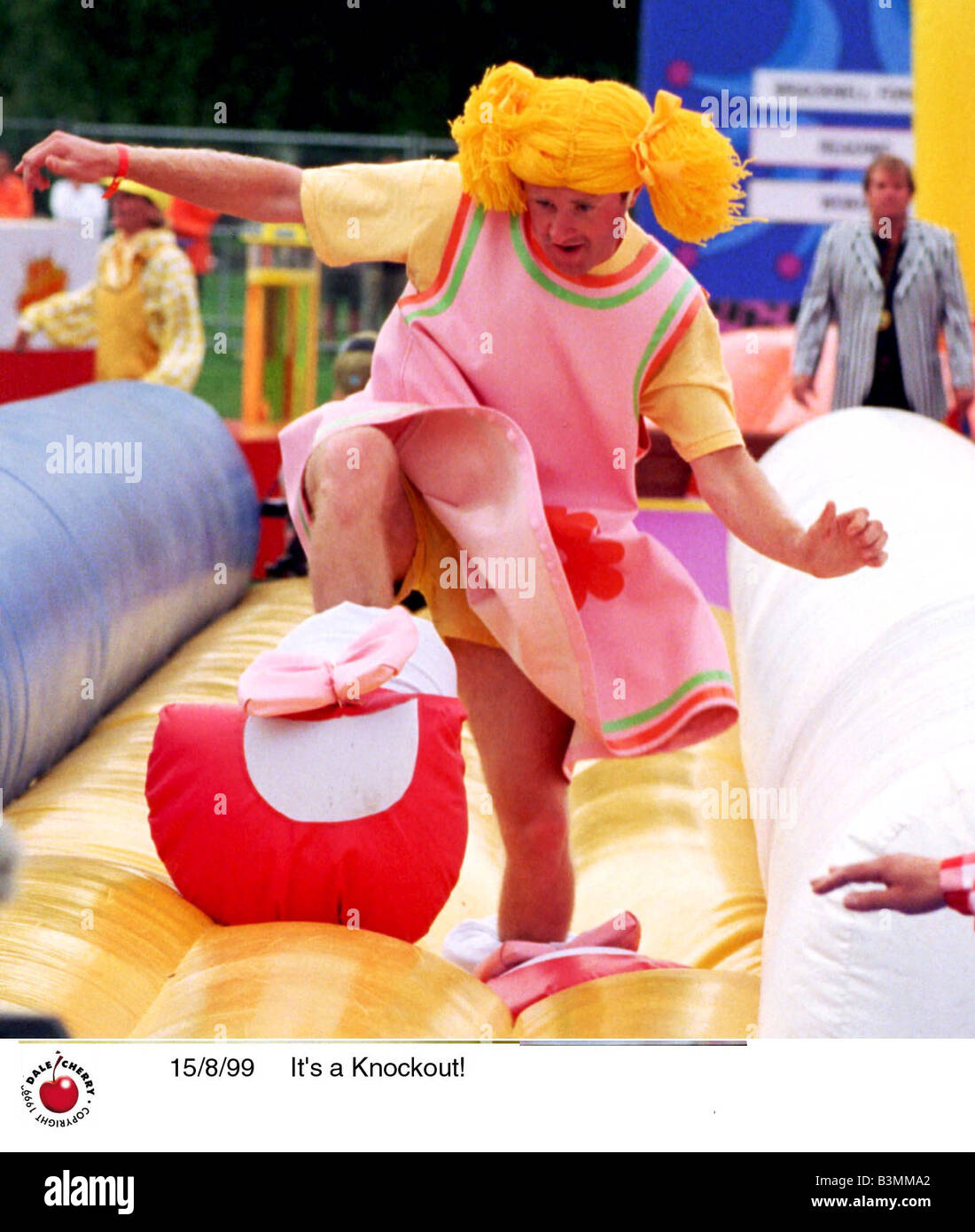 Contestants in the TV Programme Its A Knockout Aug 1999 wearing funny ...