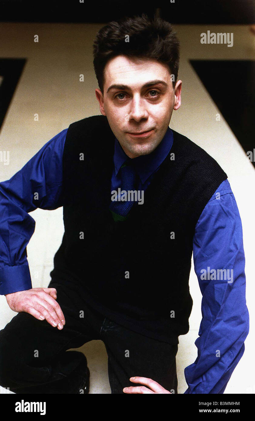 Sean Hughes TV Comedian in Black V neck cardigan and blue shirt and tie ...