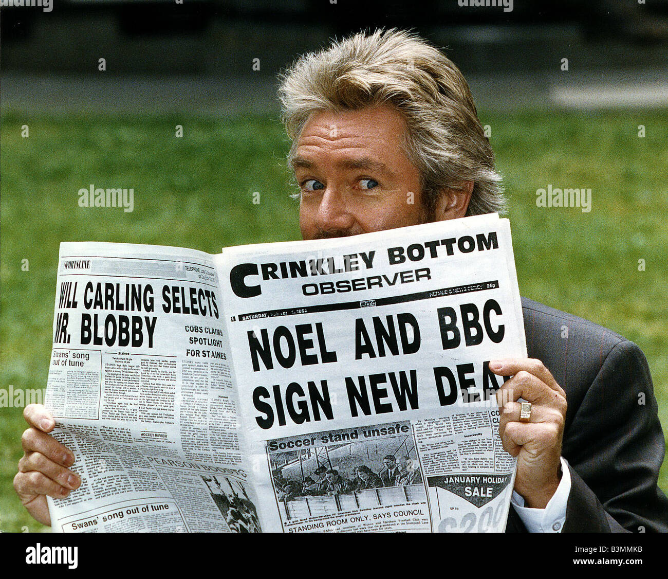 Noel Edmonds Tv Presenter reading newspaper called the Crinkley Bottom ...