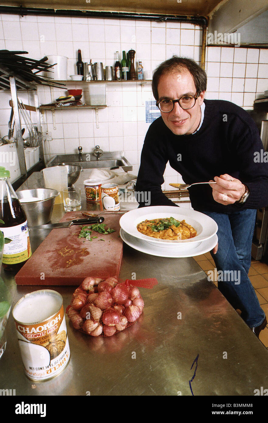 Loyd Grossman TV Presenter of Master Chef in his wn kitchen trying out ...