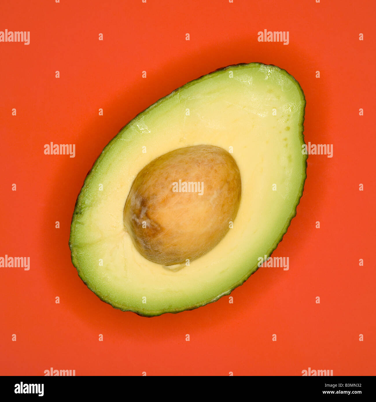 Avocado, cross section, elevated view Stock Photo - Alamy