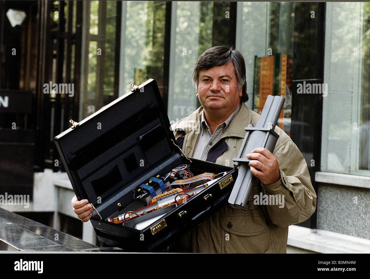 Roger Cook TV Presenter with a bomb device built in a suitcase which he ...