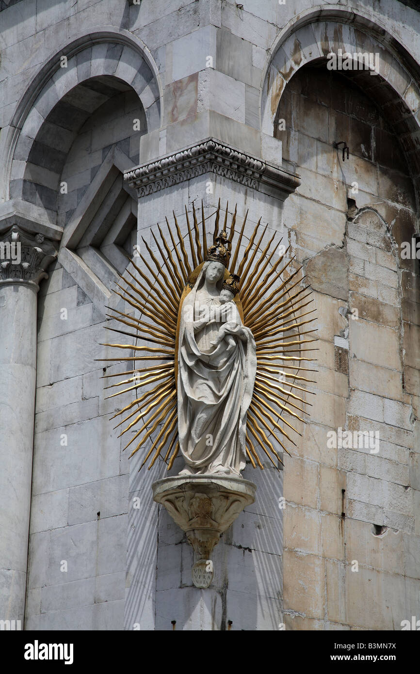 Italy Lucca A religious icon adorns the external wall of a church in ...