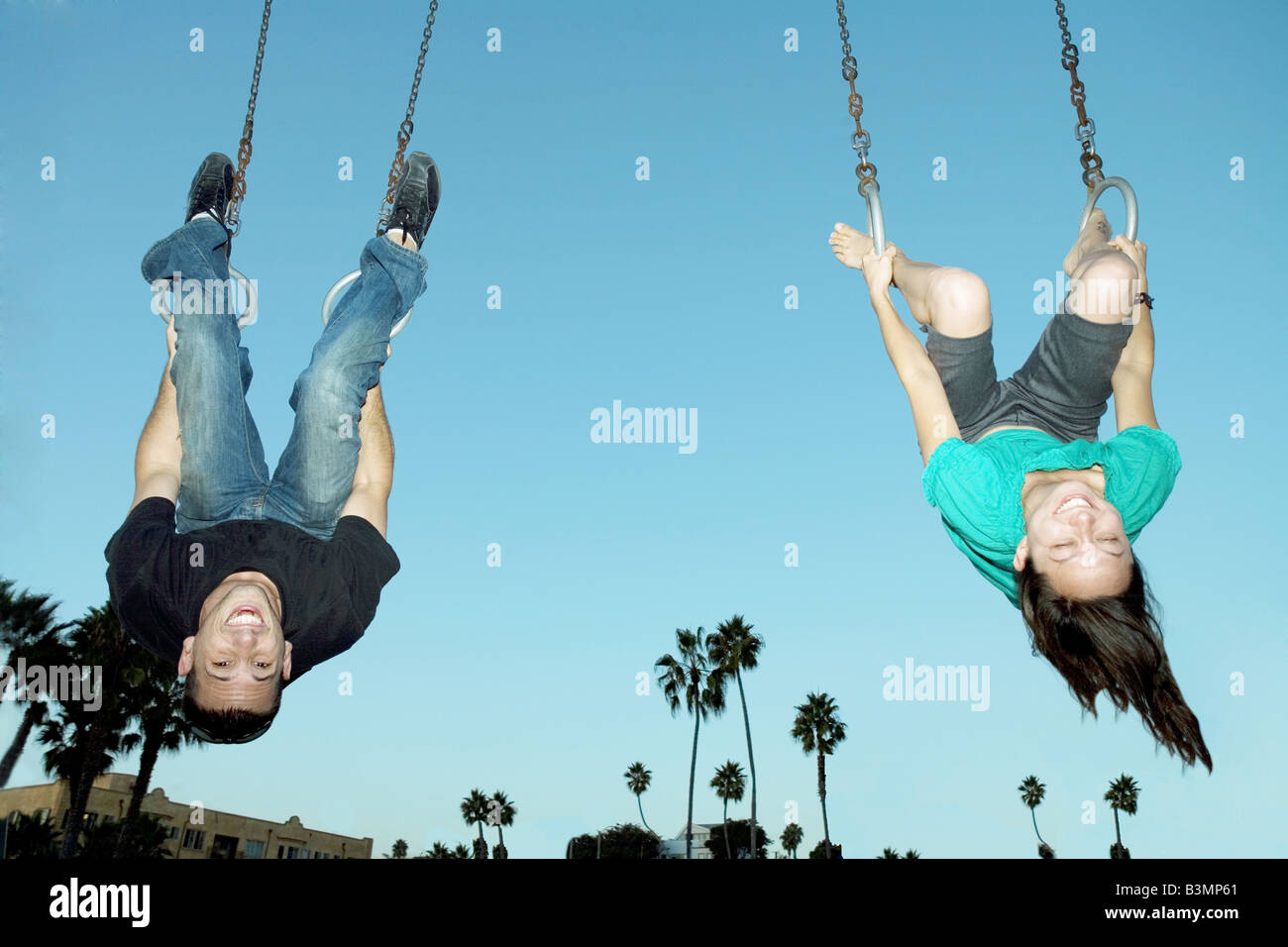 A couple enjoys an active date together on the beach in Santa Monica ...