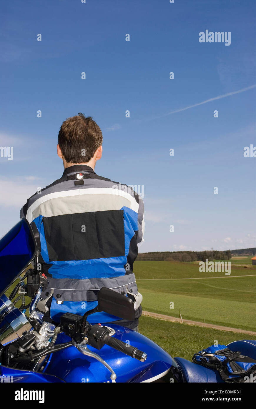 Germany, Bavaria, Biker with motorbike, rear view Stock Photo - Alamy