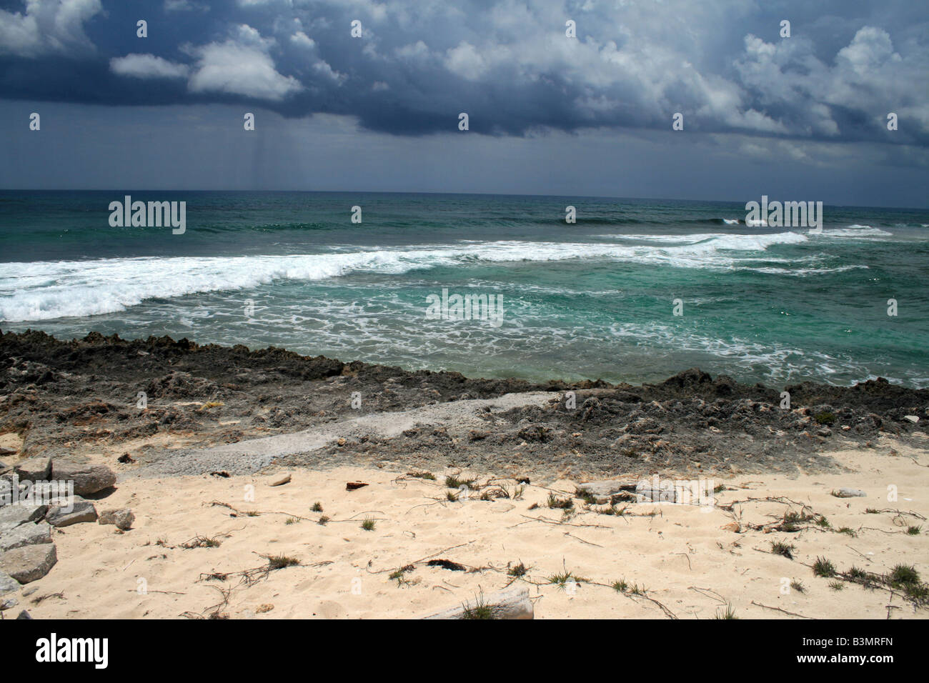 View of the coral reef shoreline on the Atlantic Ocean with storm on ...