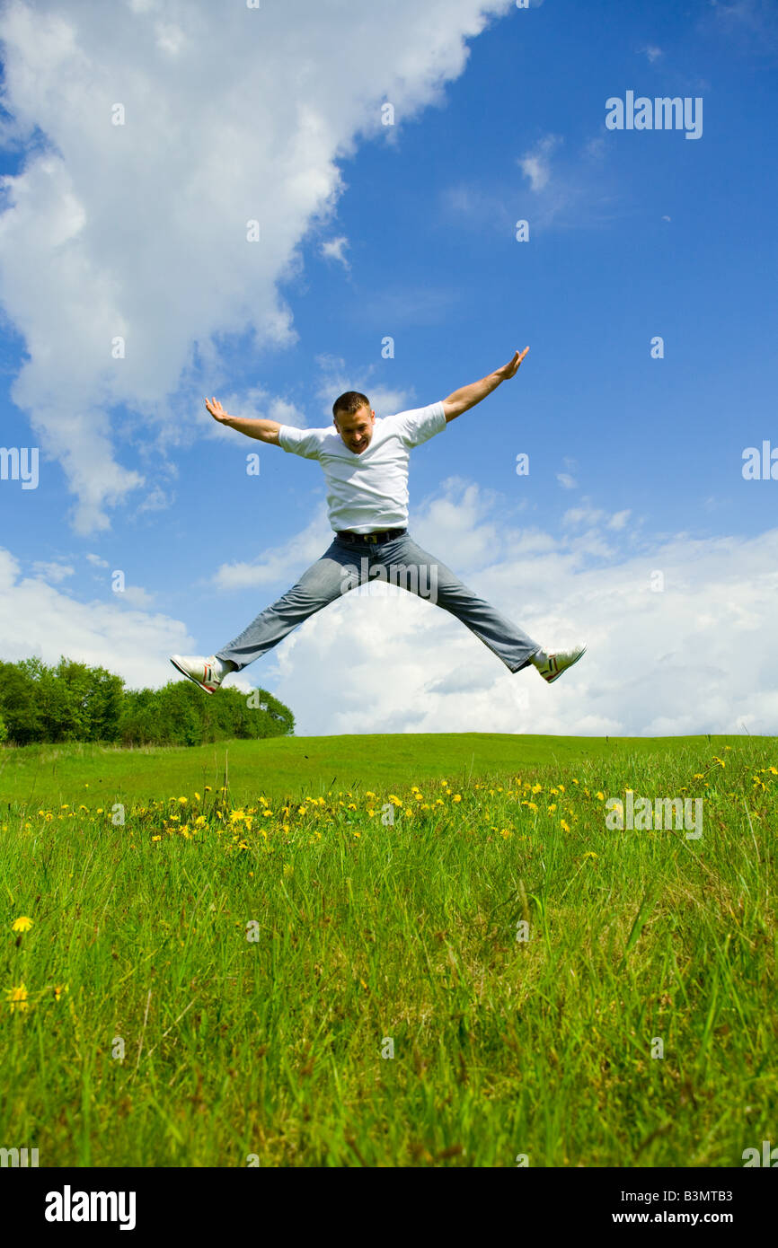 The man jumping on a lawn Stock Photo - Alamy