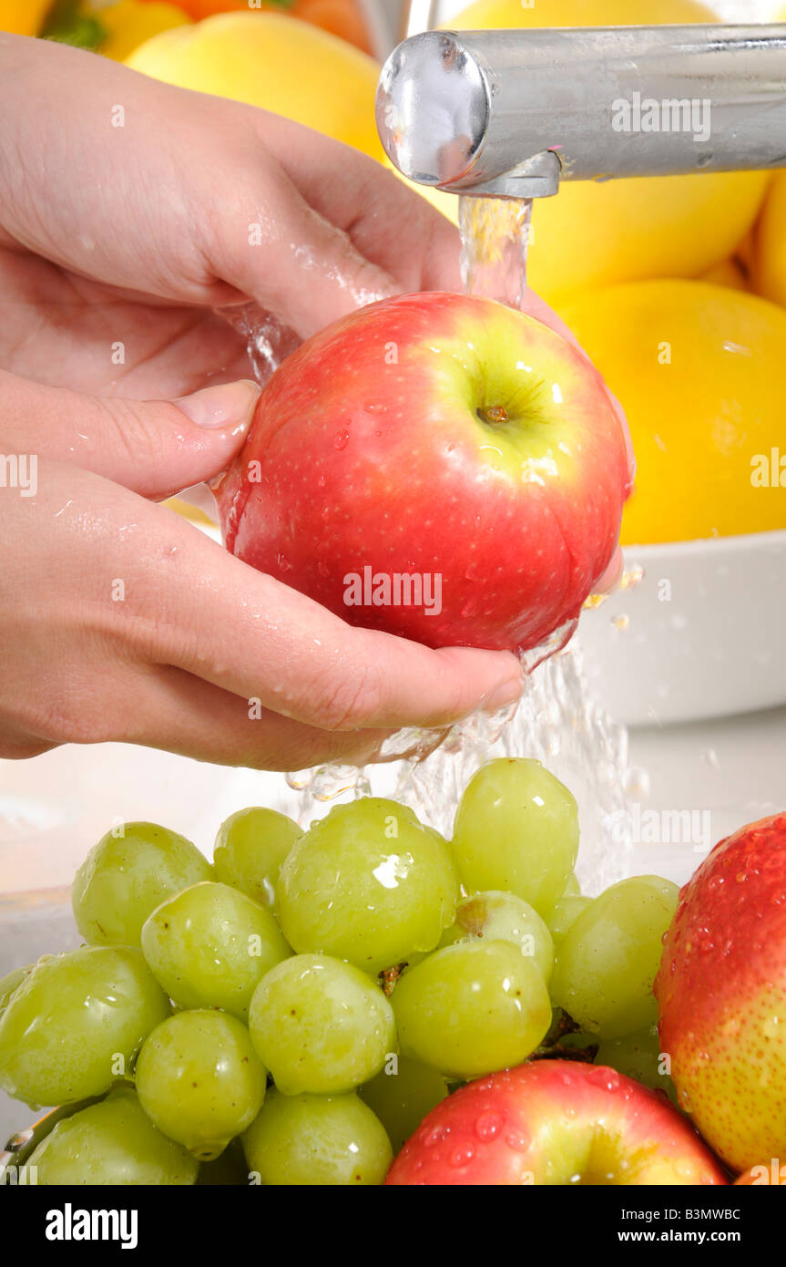 Woman washing apple hi-res stock photography and images - Alamy