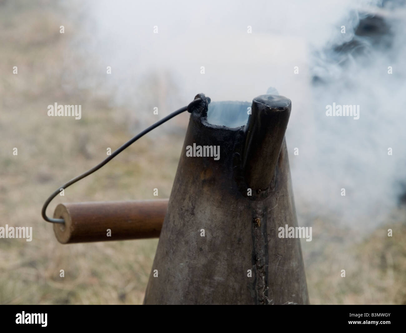 Close up of a heavy black iron kettle, boiling on a campfire Stock ...