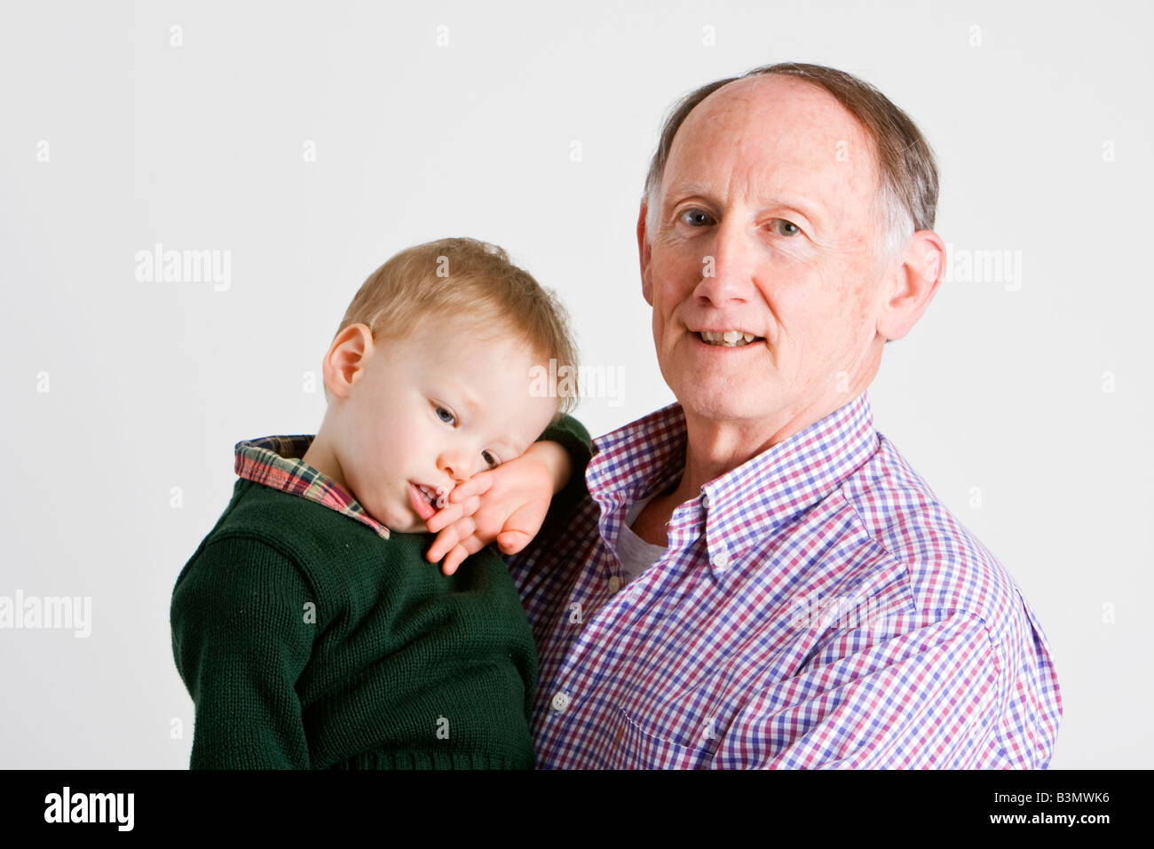 Proud grandfather holding his grandson Stock Photo - Alamy