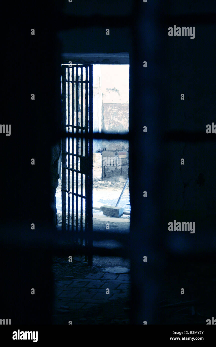 one old moody dark derelict empty prison cell Stock Photo - Alamy