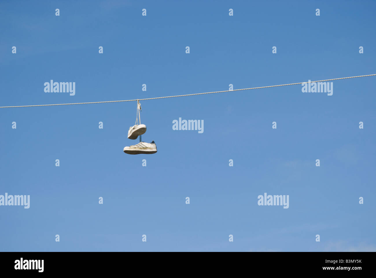Sneakers hanging telephone wire hi-res stock photography and images - Alamy