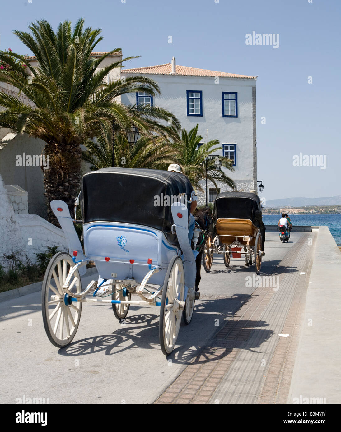 Horse drawn carriages in street, Spetses, Greece Stock Photo - Alamy