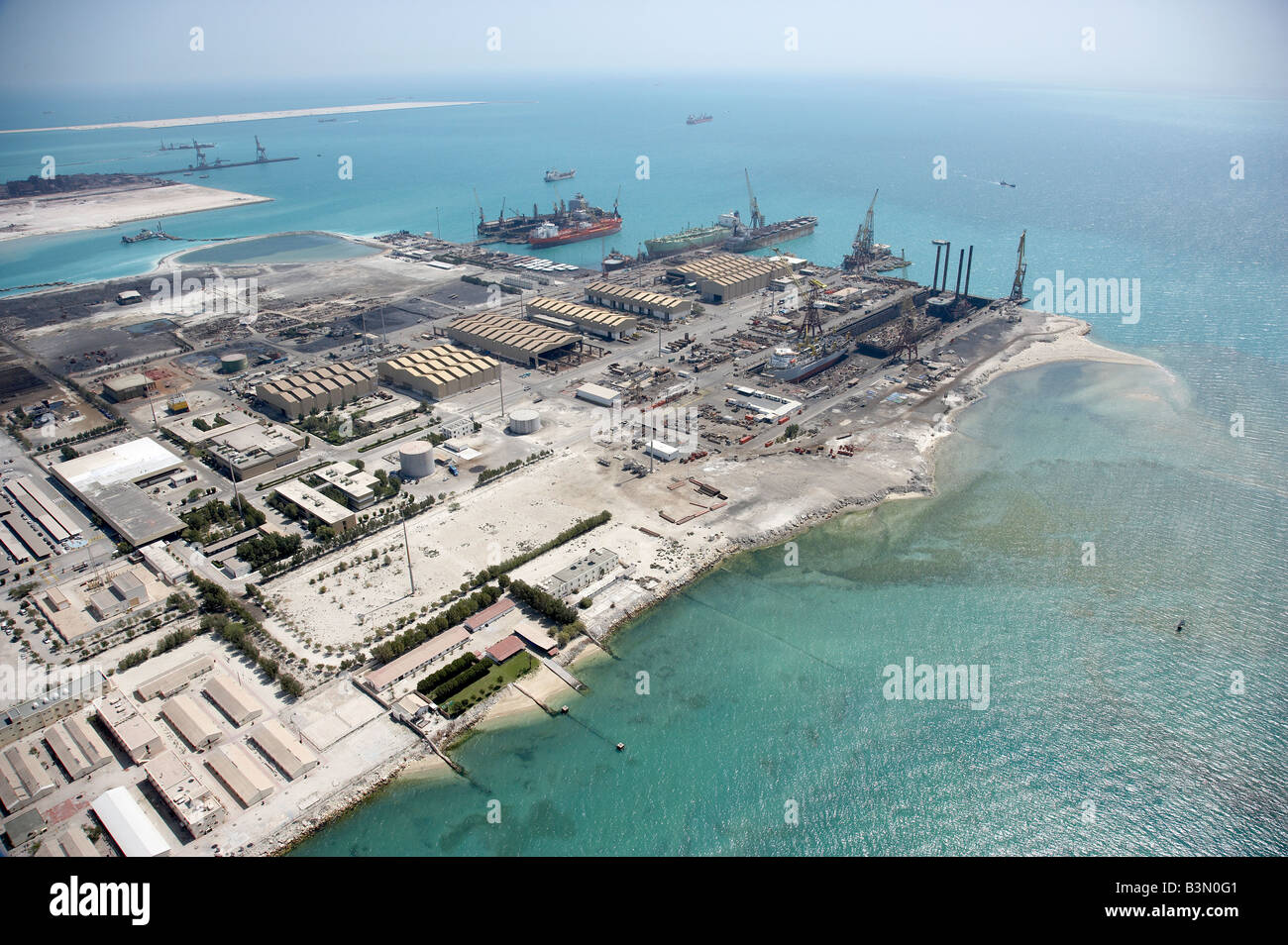 Factory industrial area dry dock dirty on the coast of Bahrain Stock ...