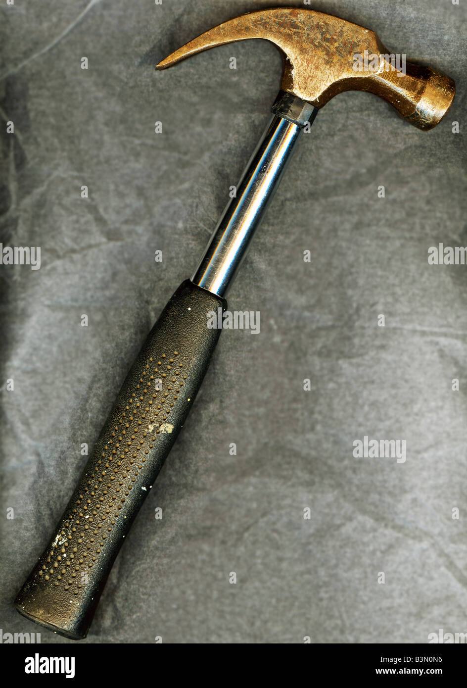 Well worn claw head hammer against a mottled grey background Stock ...