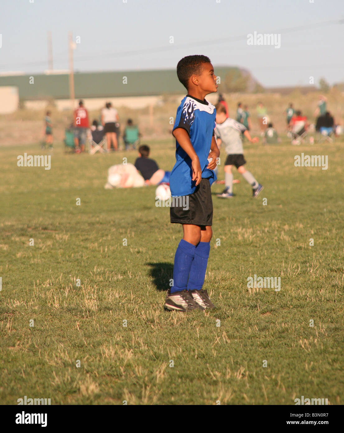 boy soccer player jumps up and down with joy Stock Photo - Alamy