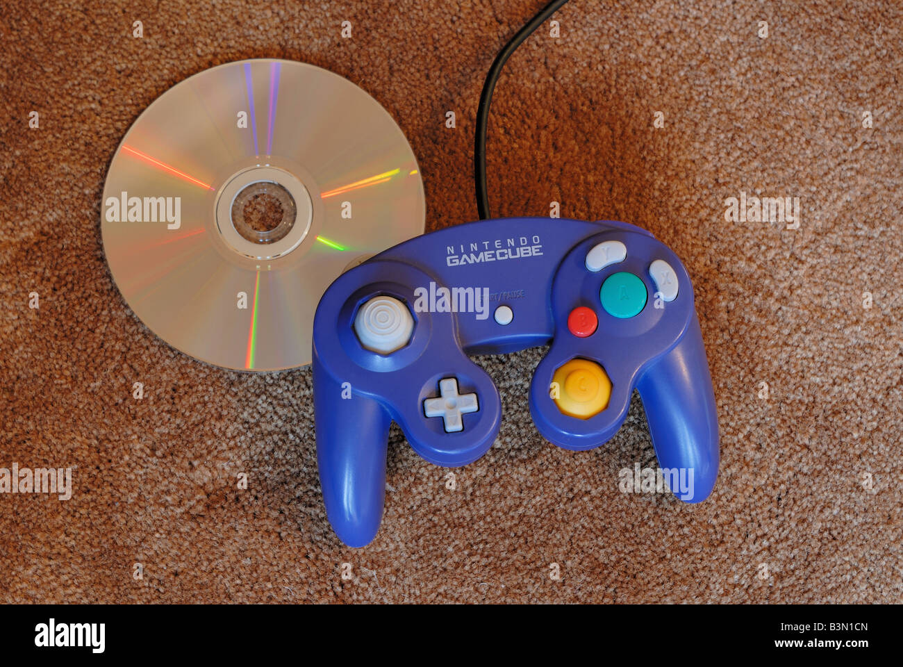 Nintendo playstation control and cd dvd on carpet Stock Photo - Alamy
