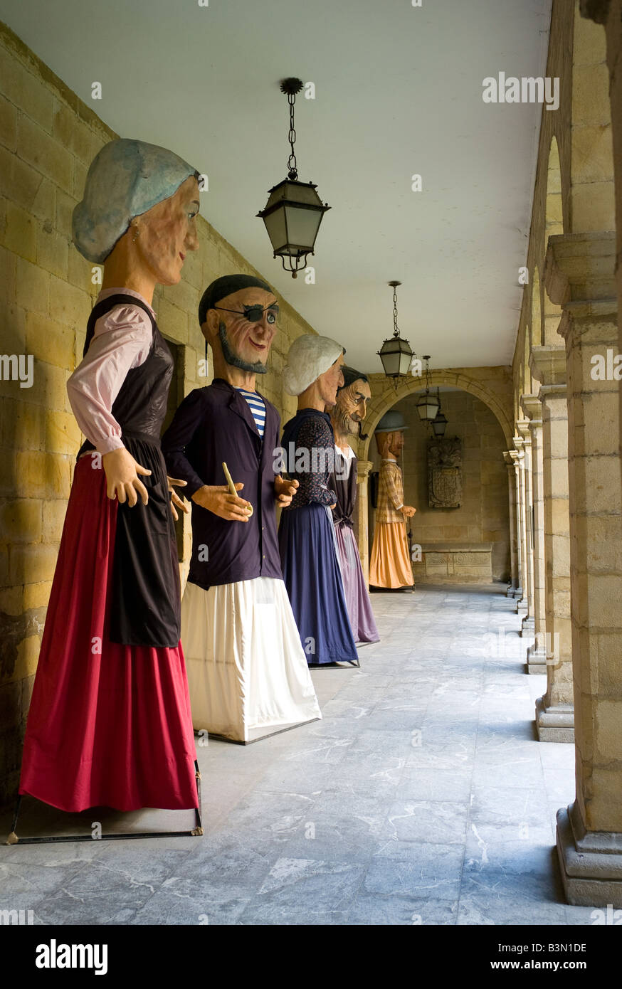 Row of gigantes (giants) on display in a colonnade of the Basque Museum ...