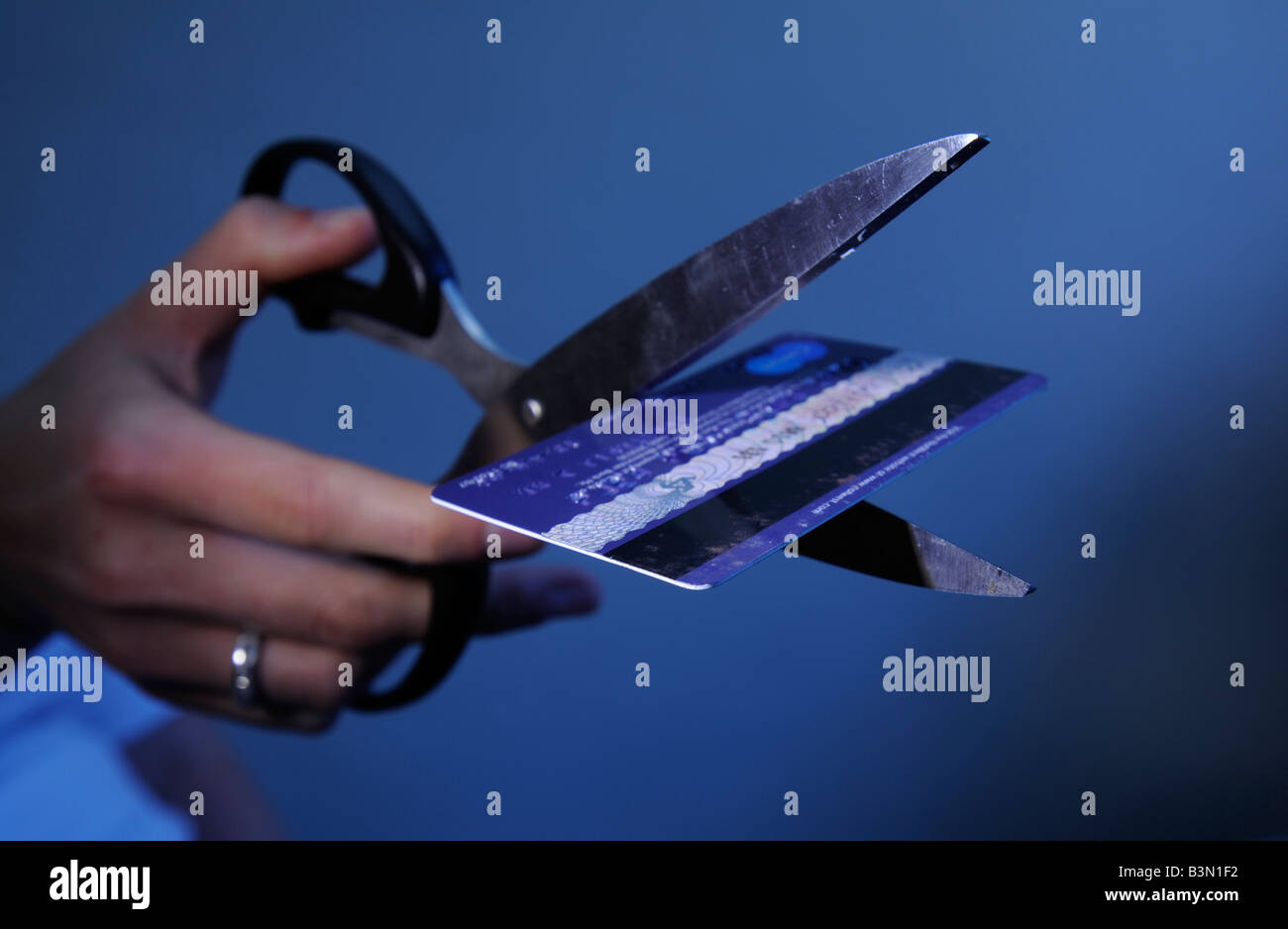 Cutting up credit card Stock Photo - Alamy