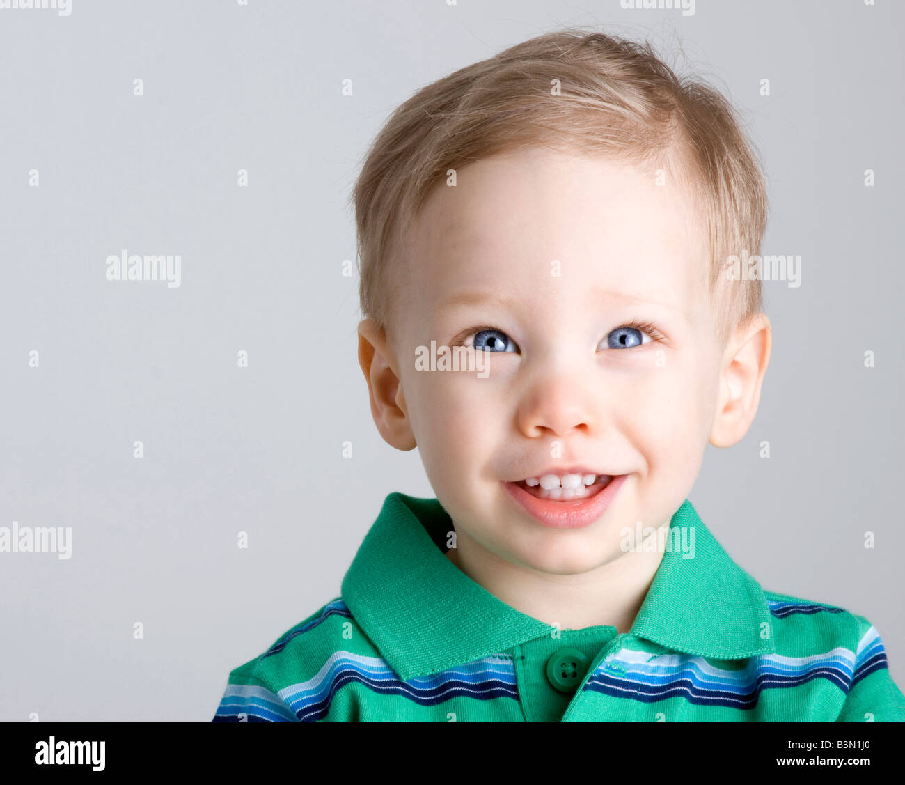 Young boy with a happy expression Stock Photo - Alamy