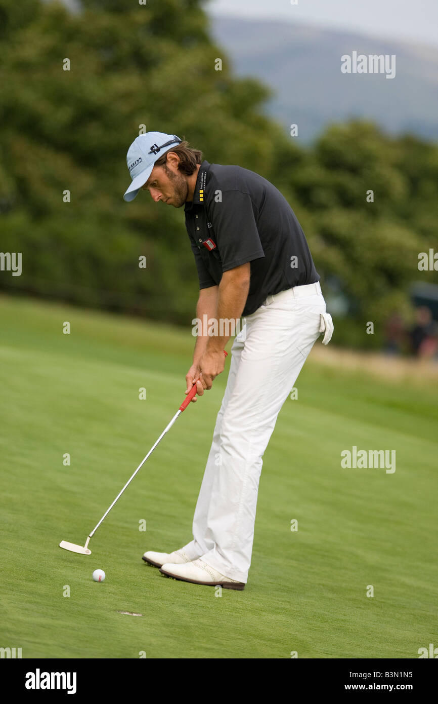 Austrian Golfer Martin Wiegele putting whilst competing in the Johnnie ...