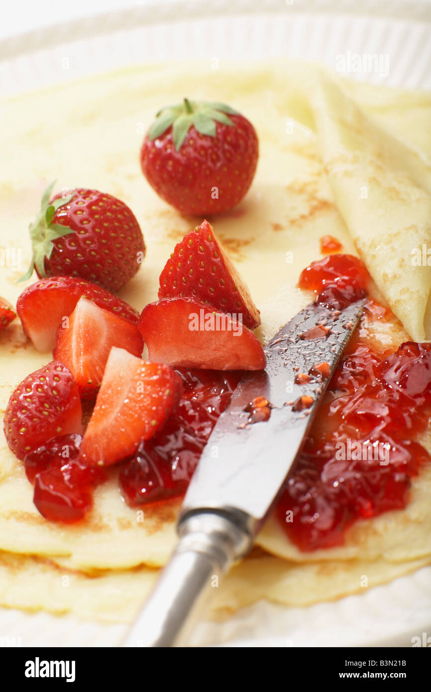 Strawberry pancake with jam on plate, close-up Stock Photo - Alamy