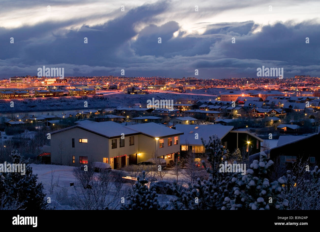 Buildings lit up at dusk in Grafarvogur district, Reykjavik, Iceland ...