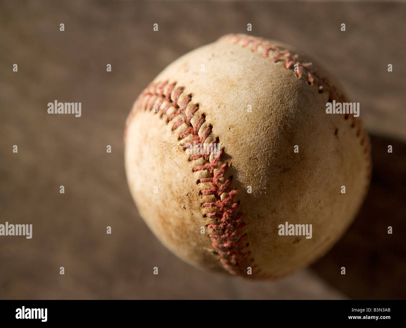 A scuffed and used baseball after hard use Stock Photo - Alamy