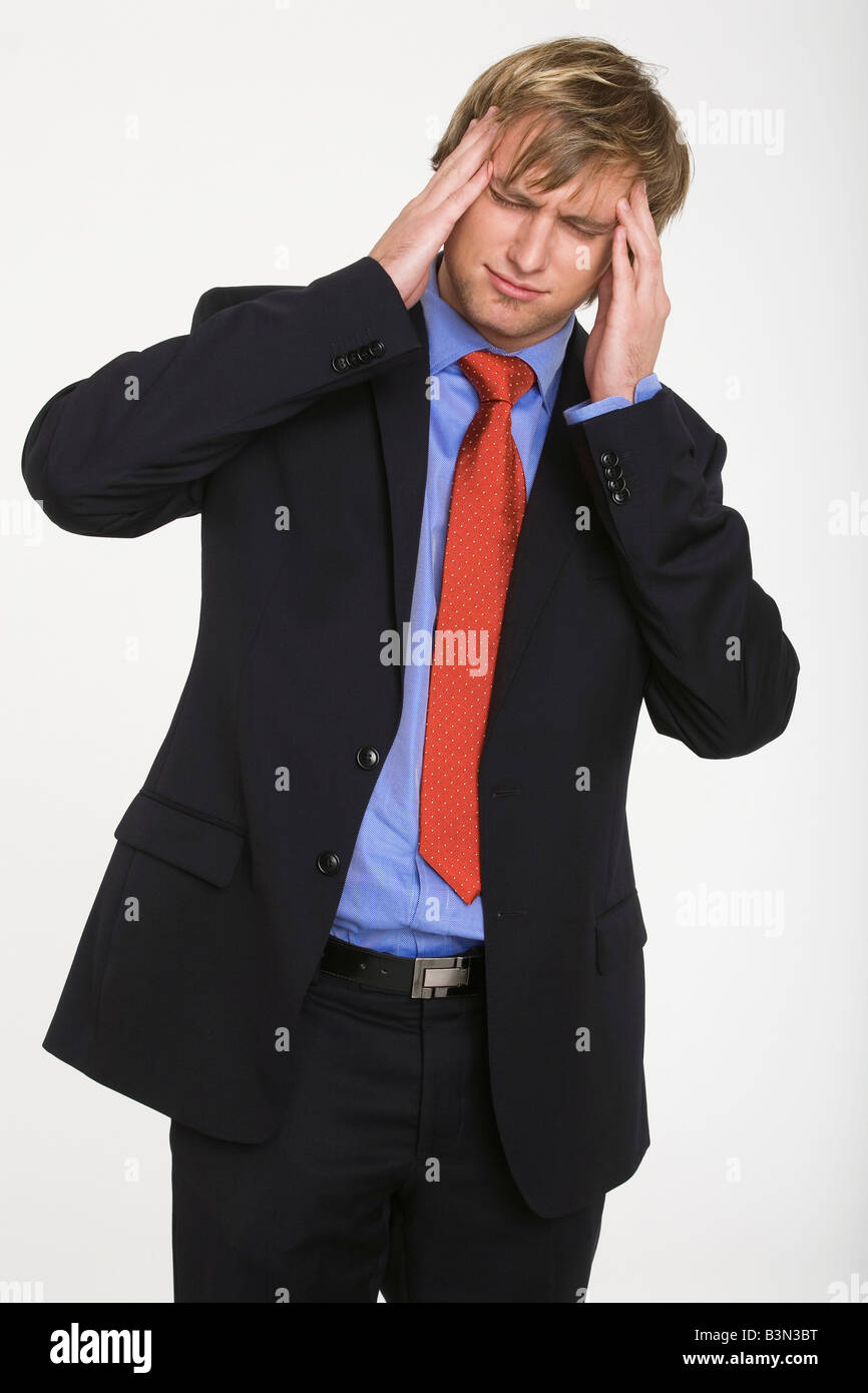 Young businessman, hands to head, portrait Stock Photo - Alamy