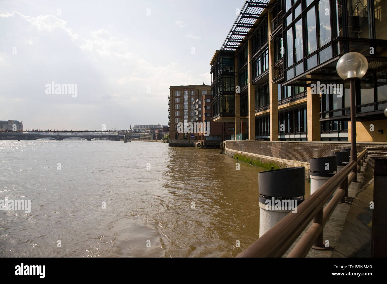 Buildings line the north bank of the River Thames near Southwark Bridge ...