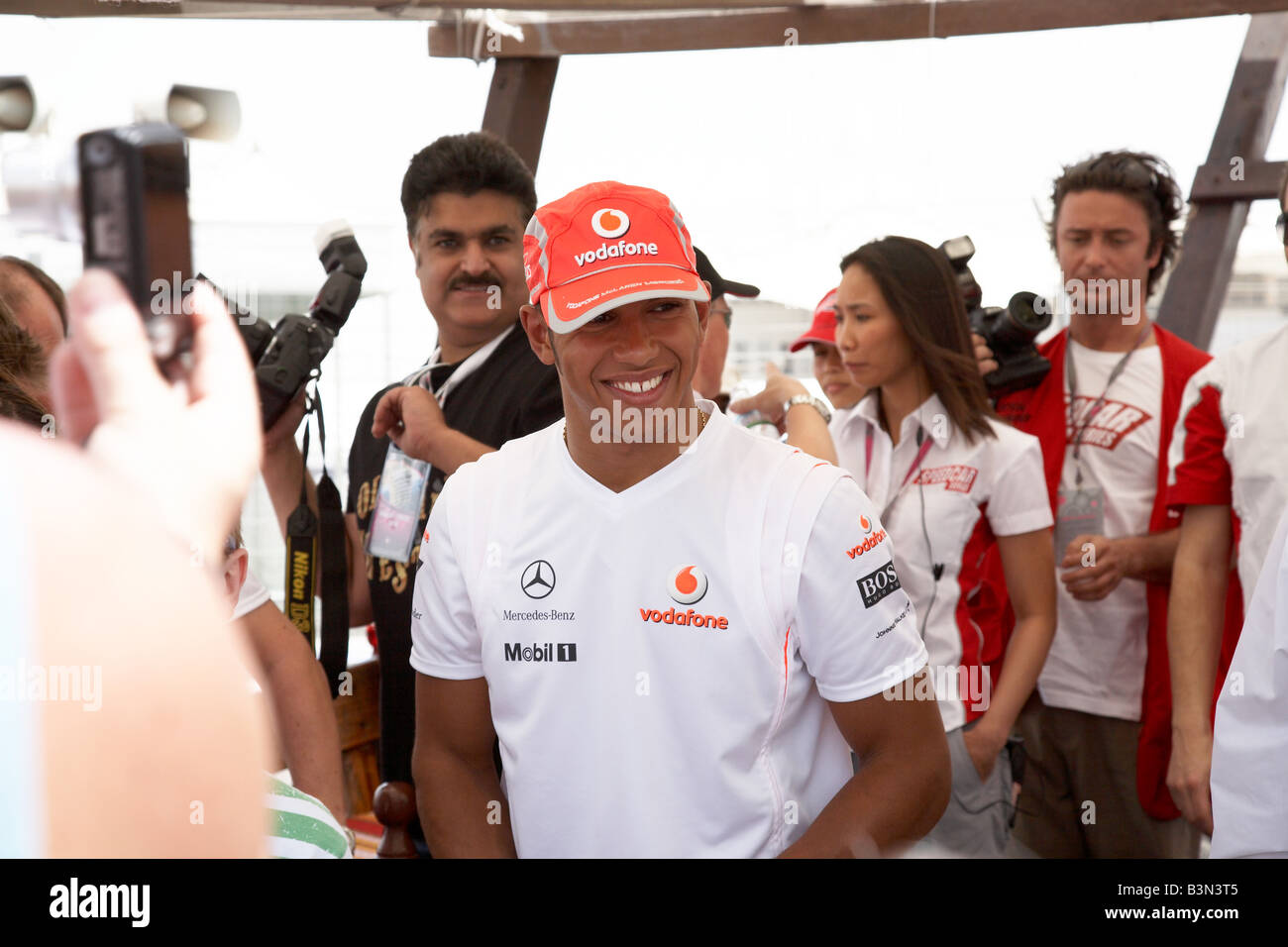 Lewis Hamilton smiles to fans and photographers at the 2008 F1 Formula ...
