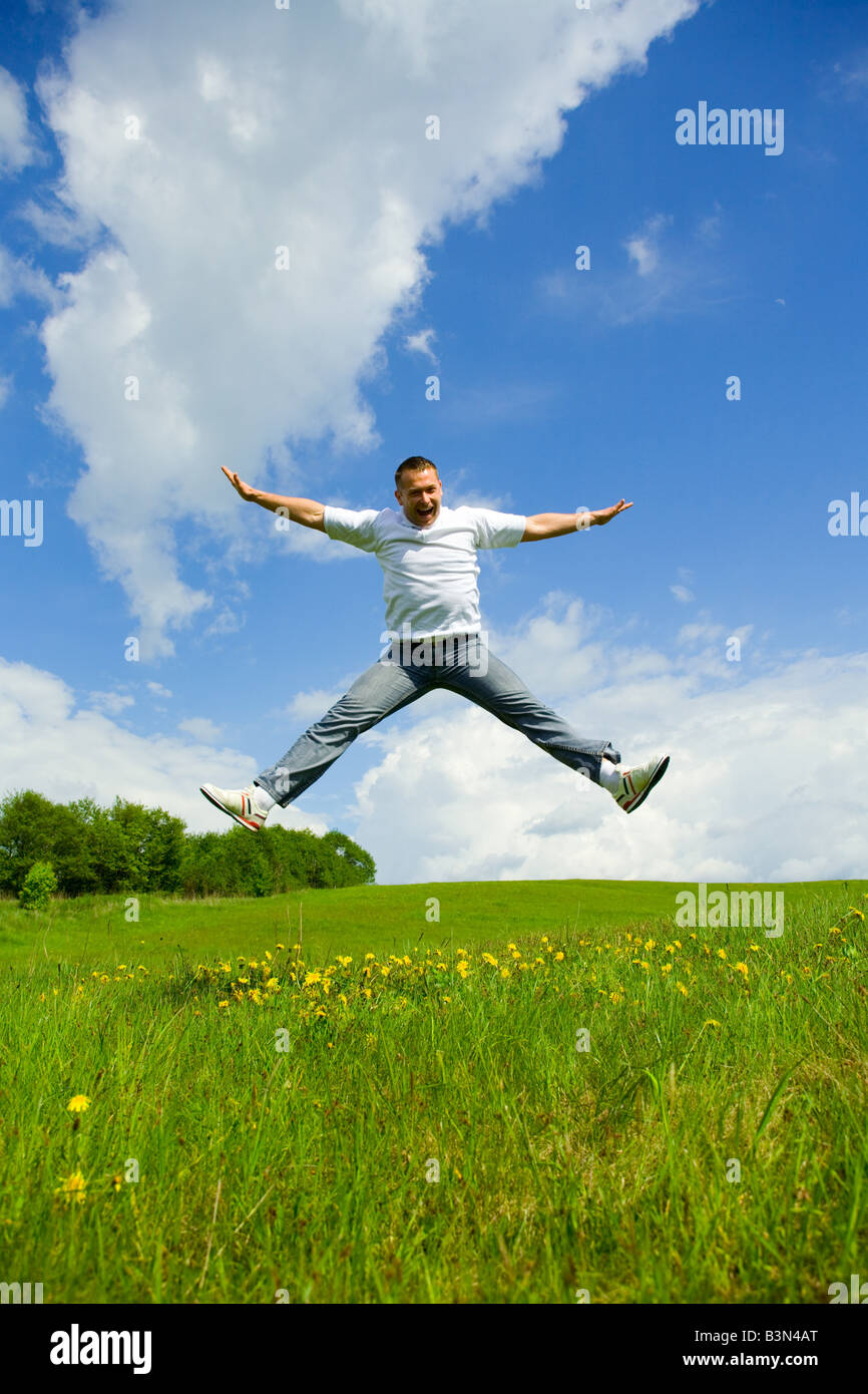 The man jumping on a lawn Stock Photo - Alamy