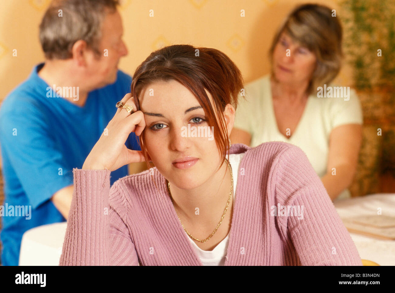 parents arguing behind teenage girl Stock Photo - Alamy