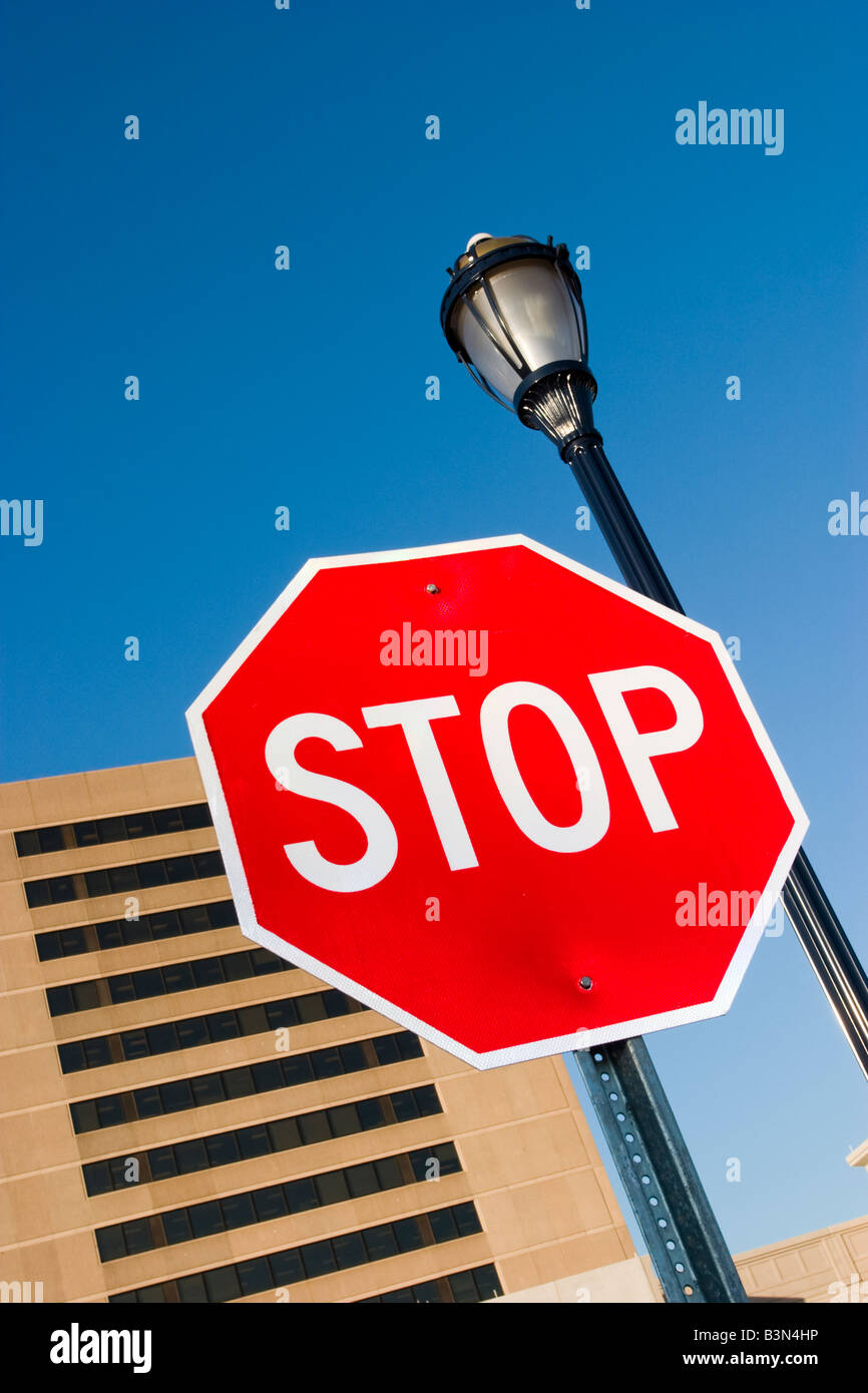 Stop sign in front of a building and lamppost in downtown Hartford ...