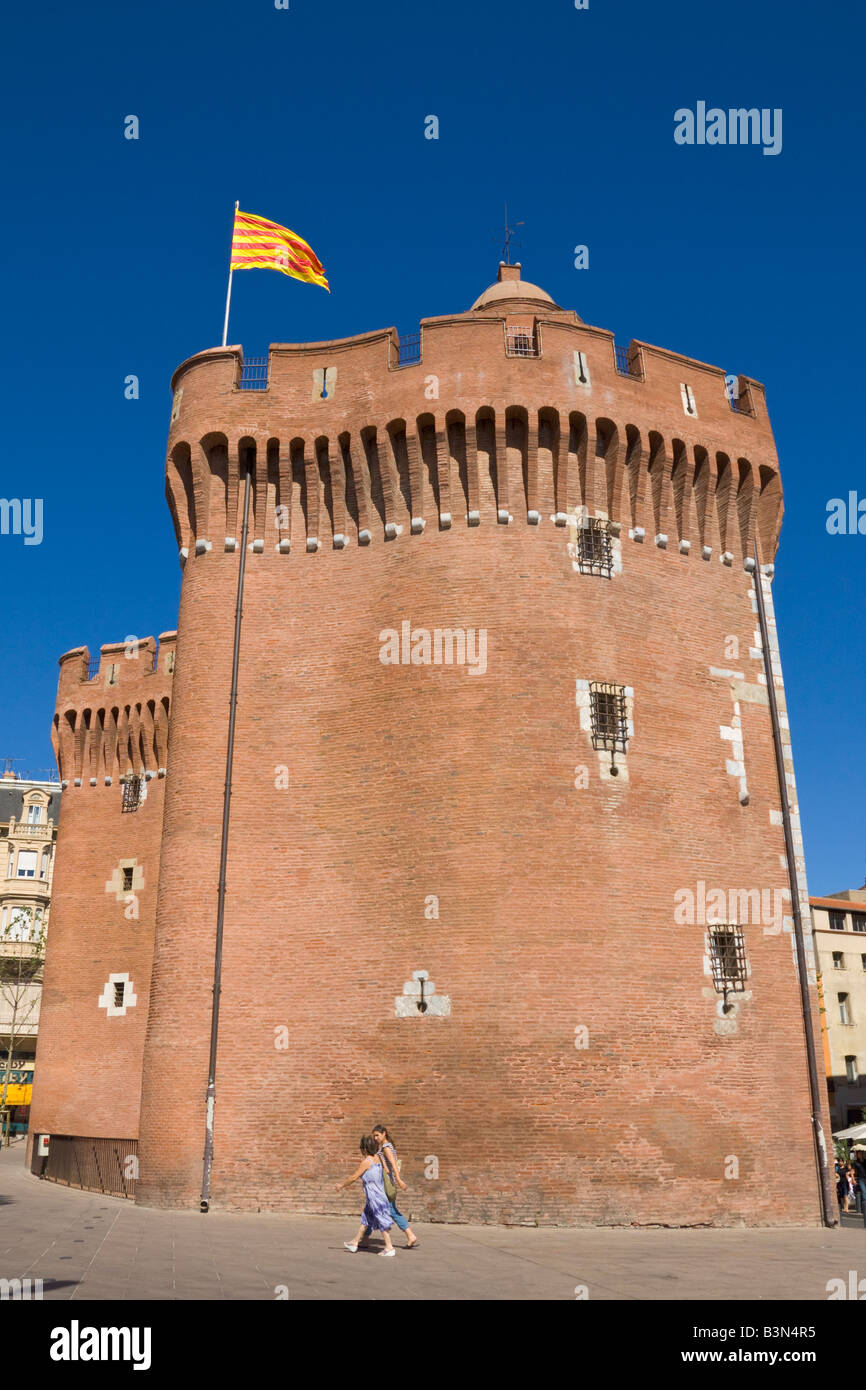 The Catalonian flag is blowing above the city gate "Le Castillet" in ...