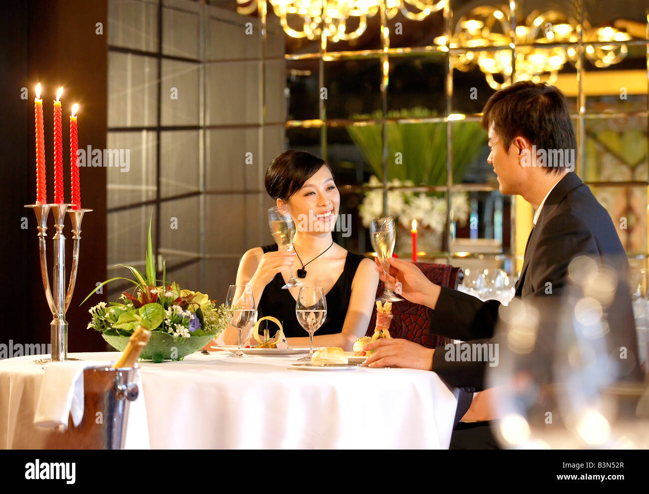 Couple having dinner together Stock Photo - Alamy
