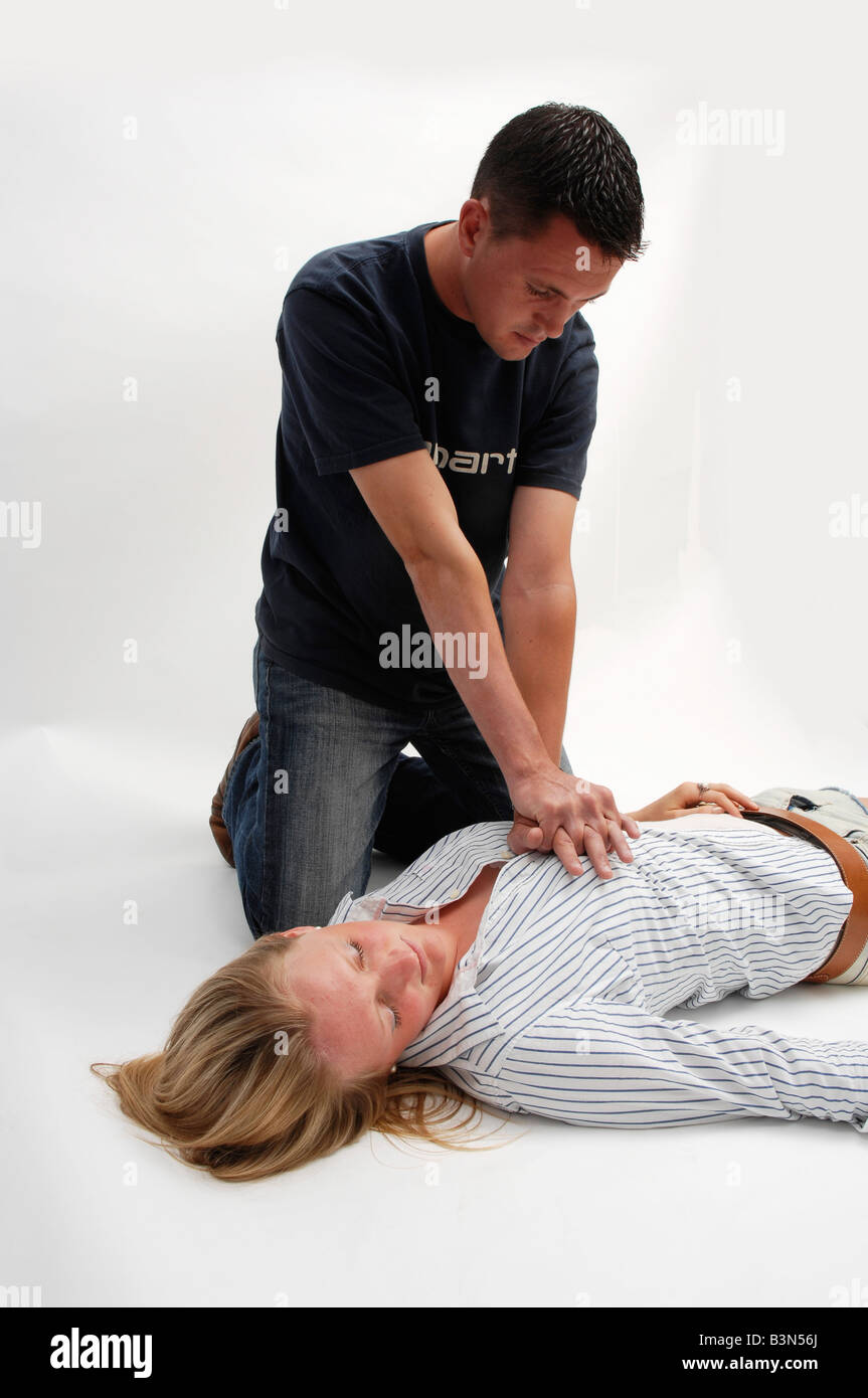 A man giving a girl first aid Stock Photo - Alamy